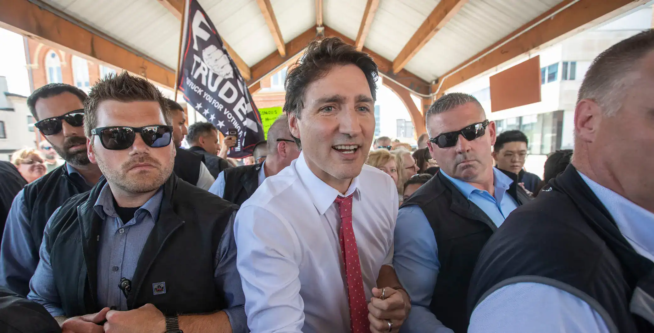 Trudeau swarmed by nearly 100 protesters in Belleville Ont., forced to ...