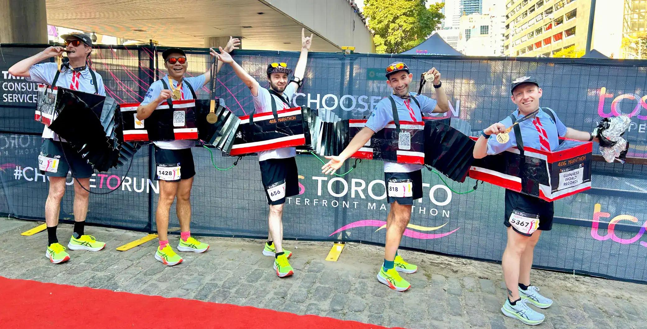 Toronto marathon runners dressed as TTC streetcar break world record ...